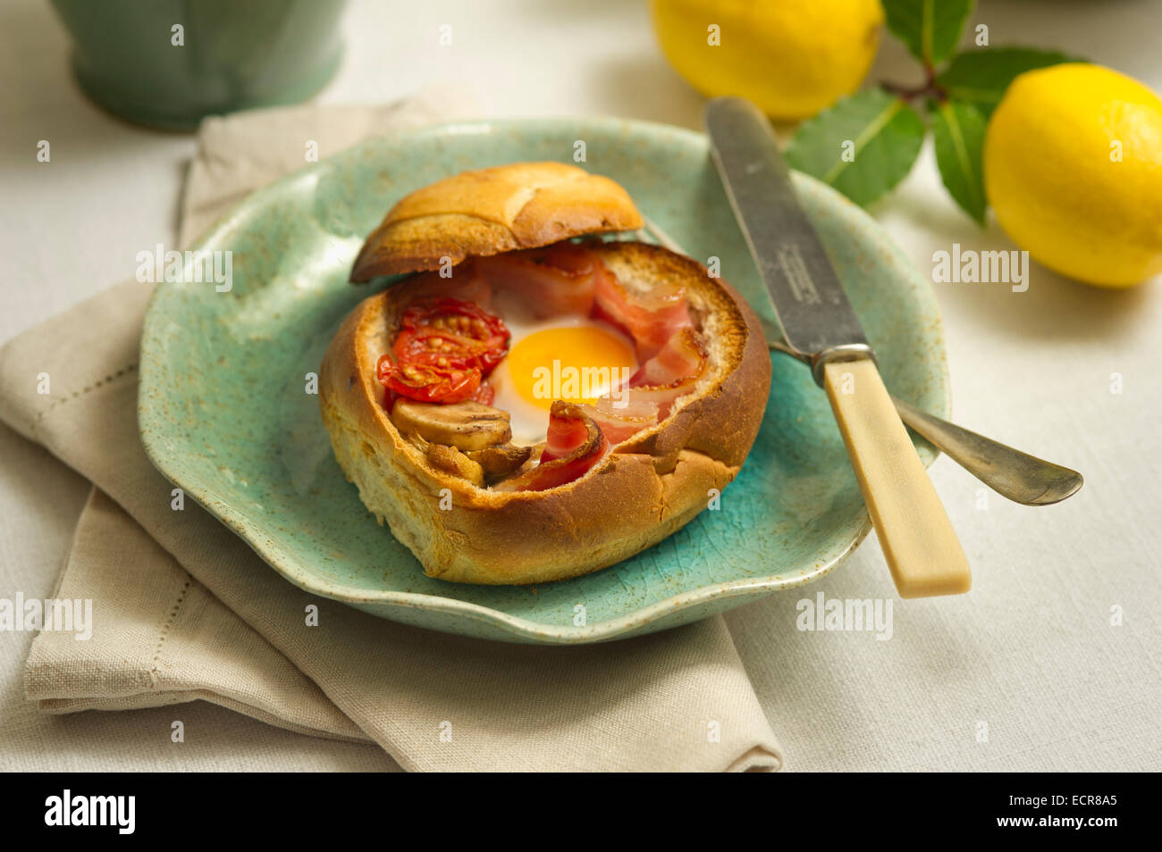 Breakfast baps/rolls with eggs, bacon, mushrooms and tomato Stock Photo ...