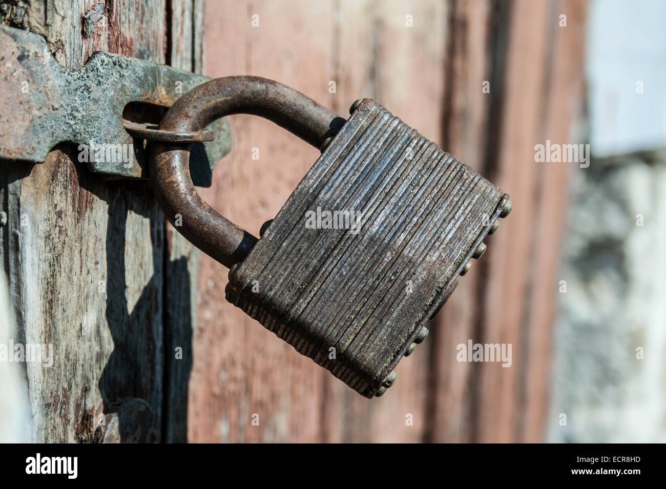 Old rusty padlock on wooden door Stock Photo - Alamy
