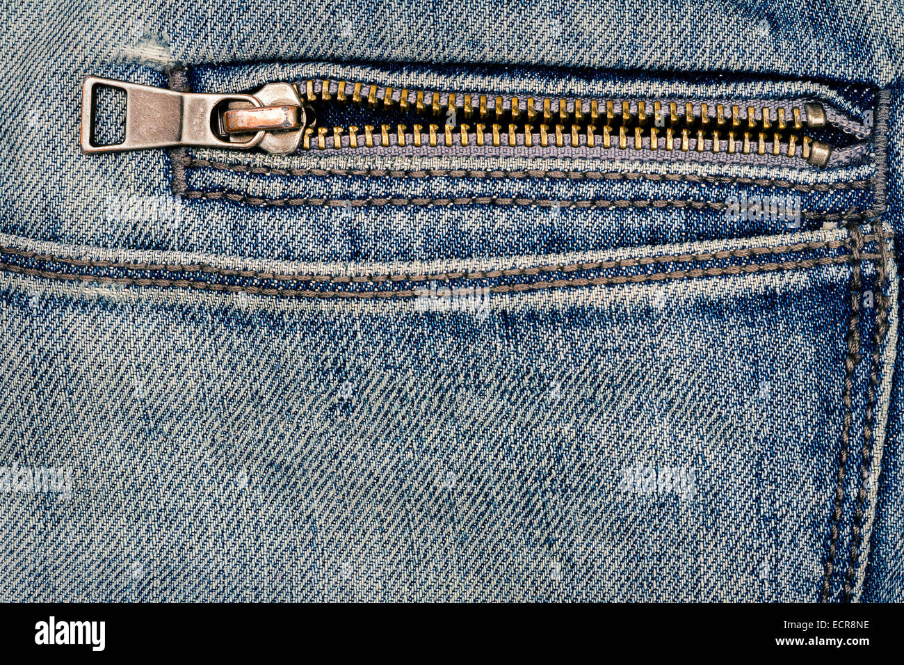 Blue jeans fabric with zipper background Stock Photo - Alamy