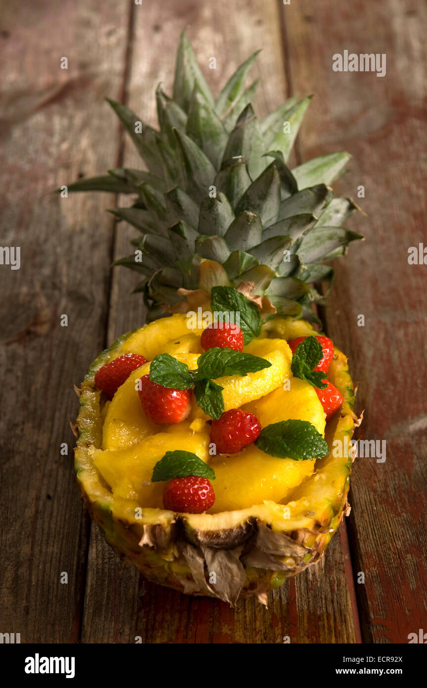 A fruit salad in a hollowed out pineapple Stock Photo - Alamy