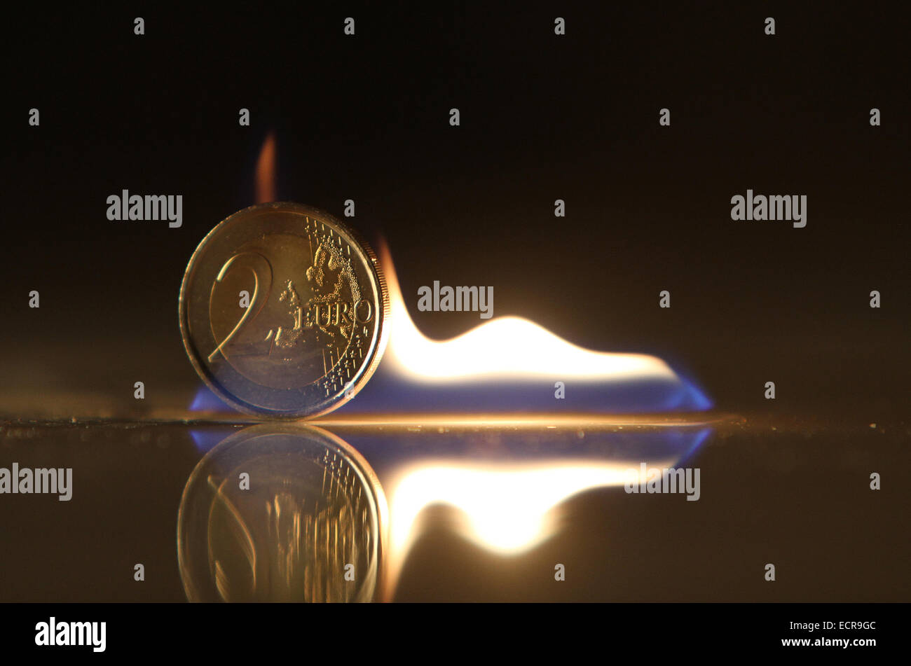 EURO COIN ON FIRE Stock Photo - Alamy