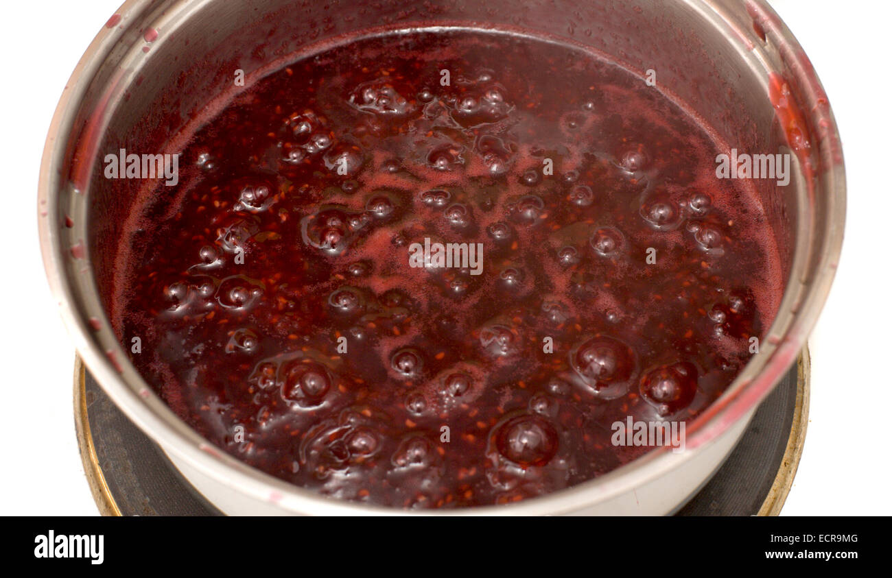 A pan of boiling fruit on a stove in readiness for making some homemade ...