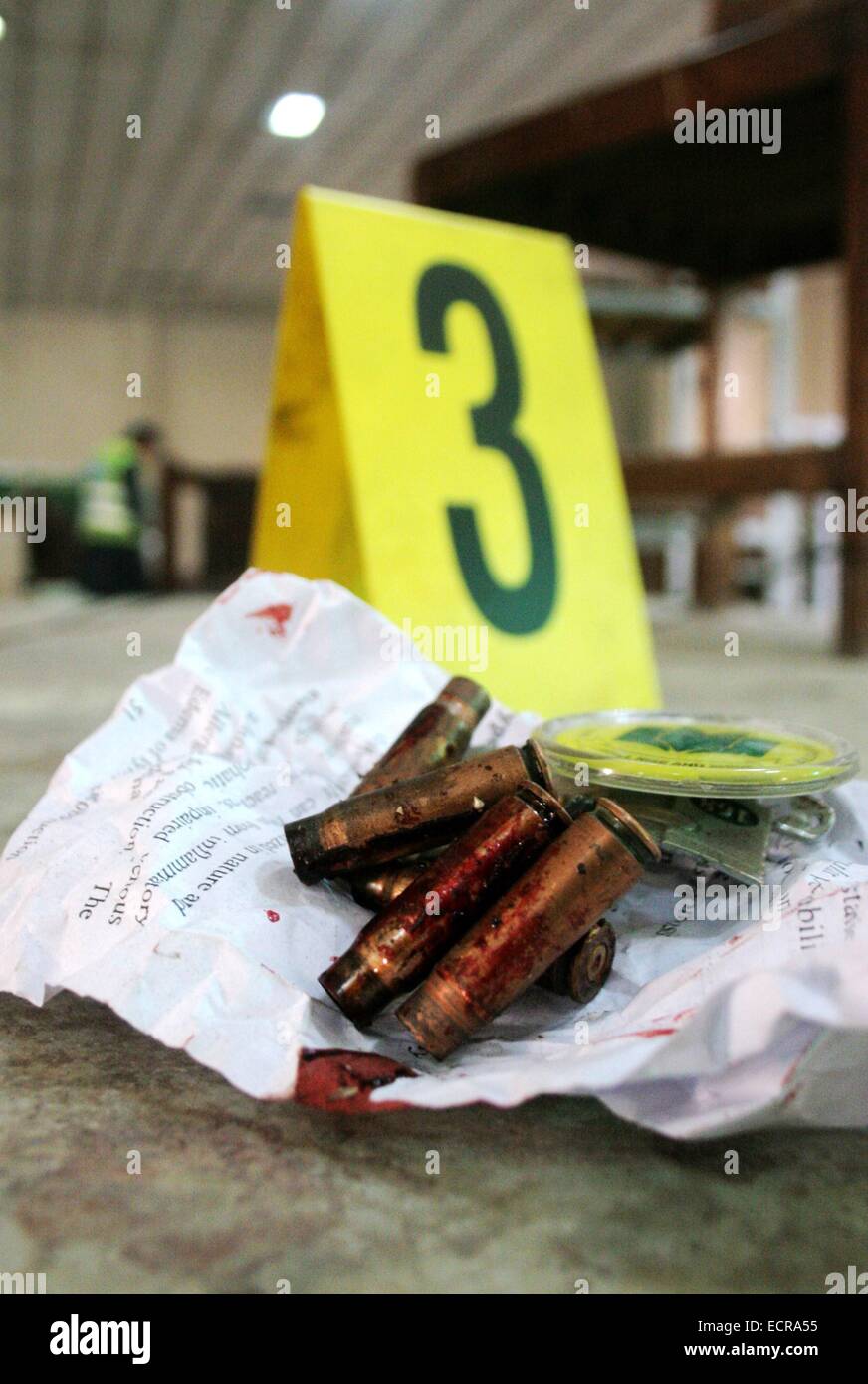 Peshawar. 18th Dec, 2014. Bullet shells are seen at the site of the ...