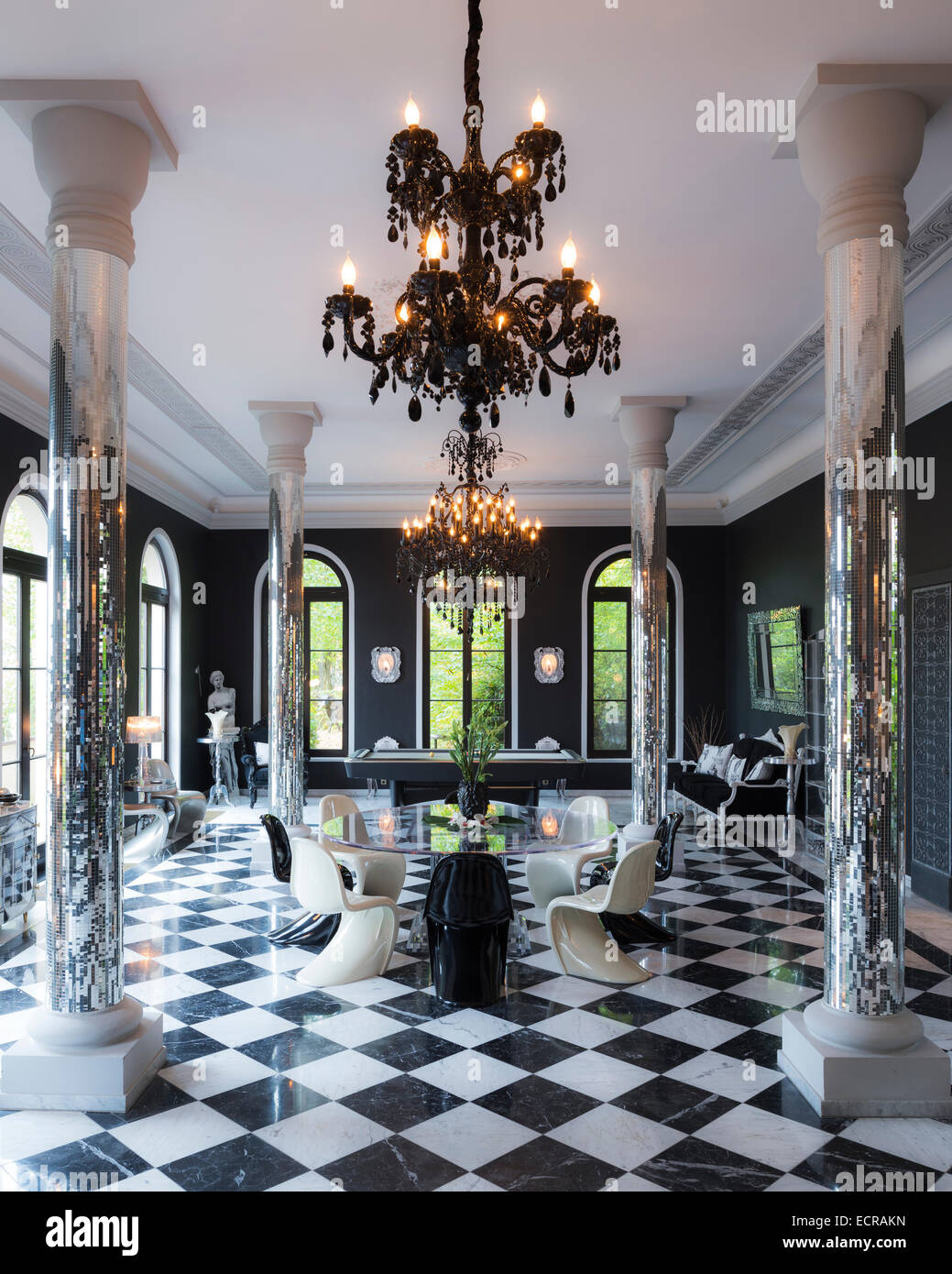Mirrored pillars in games room with Panton S chairs and black and white ...