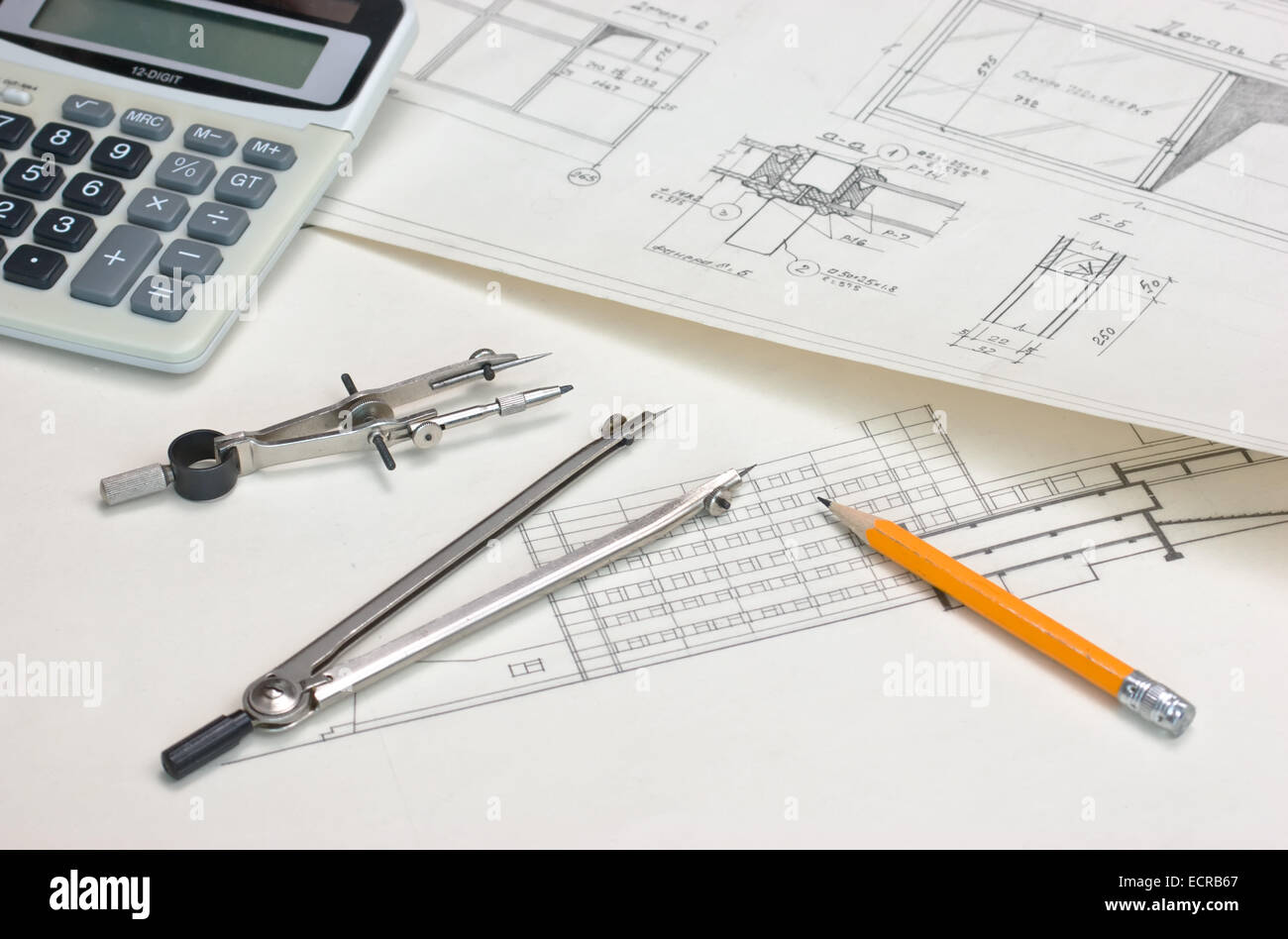 technical drawings and a calculator Stock Photo - Alamy