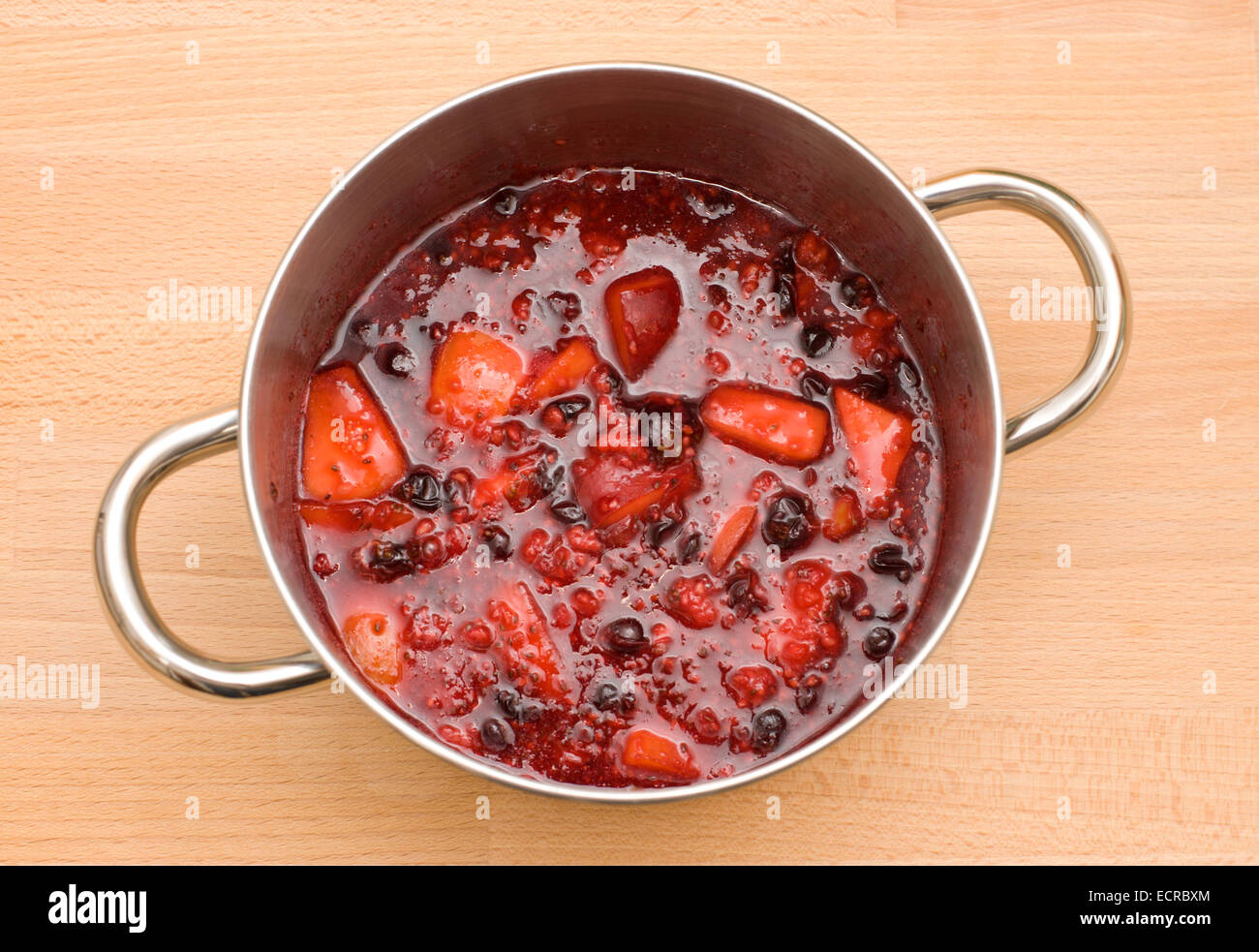 A pot of boiling fruit being reduced in readiness for jam making plus ...