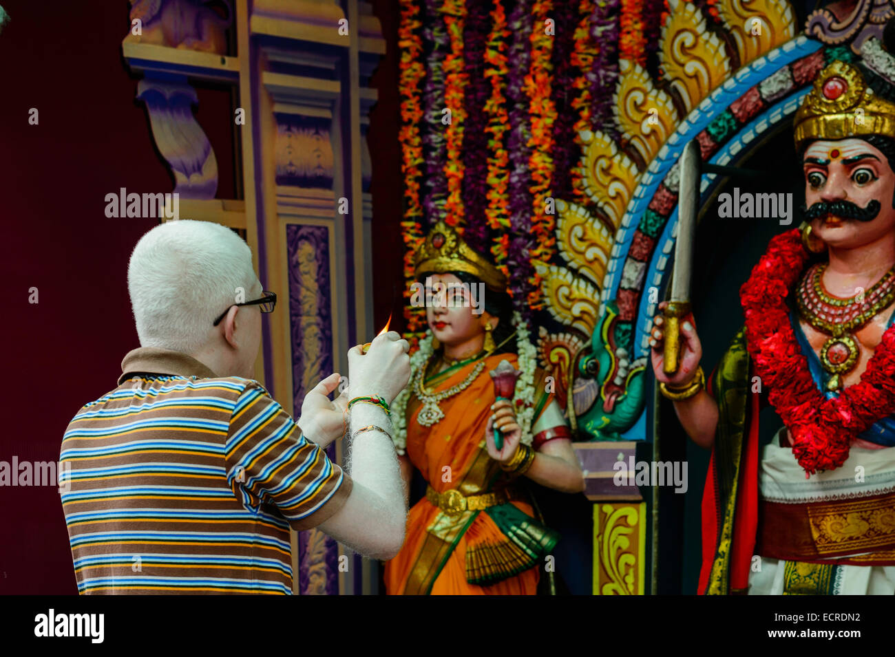 Praying at the temple Stock Photo - Alamy
