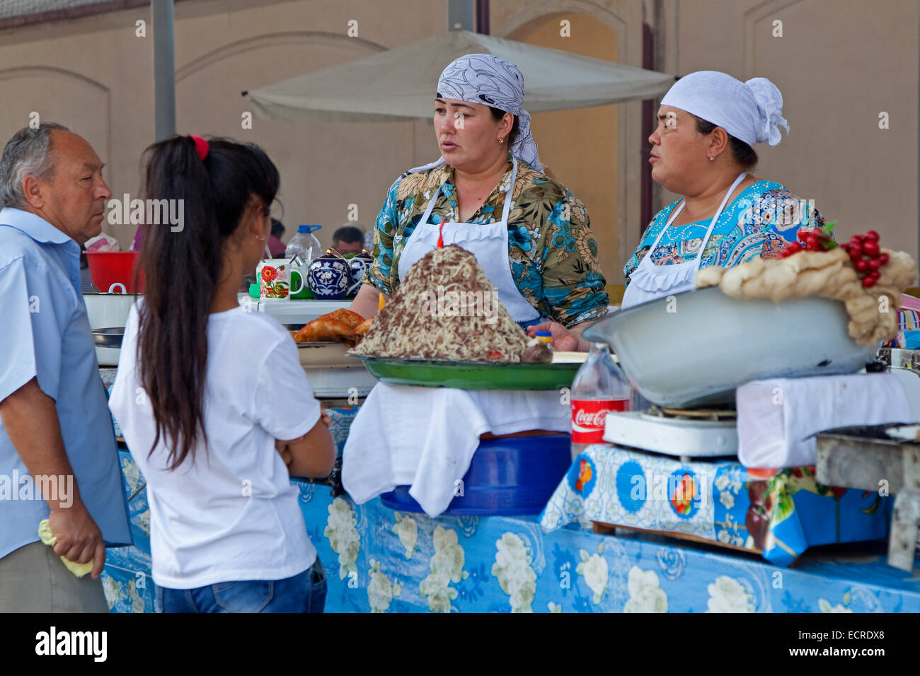 Women selling naryn / norin, Uzbek pasta dish of fresh hand-rolled ...