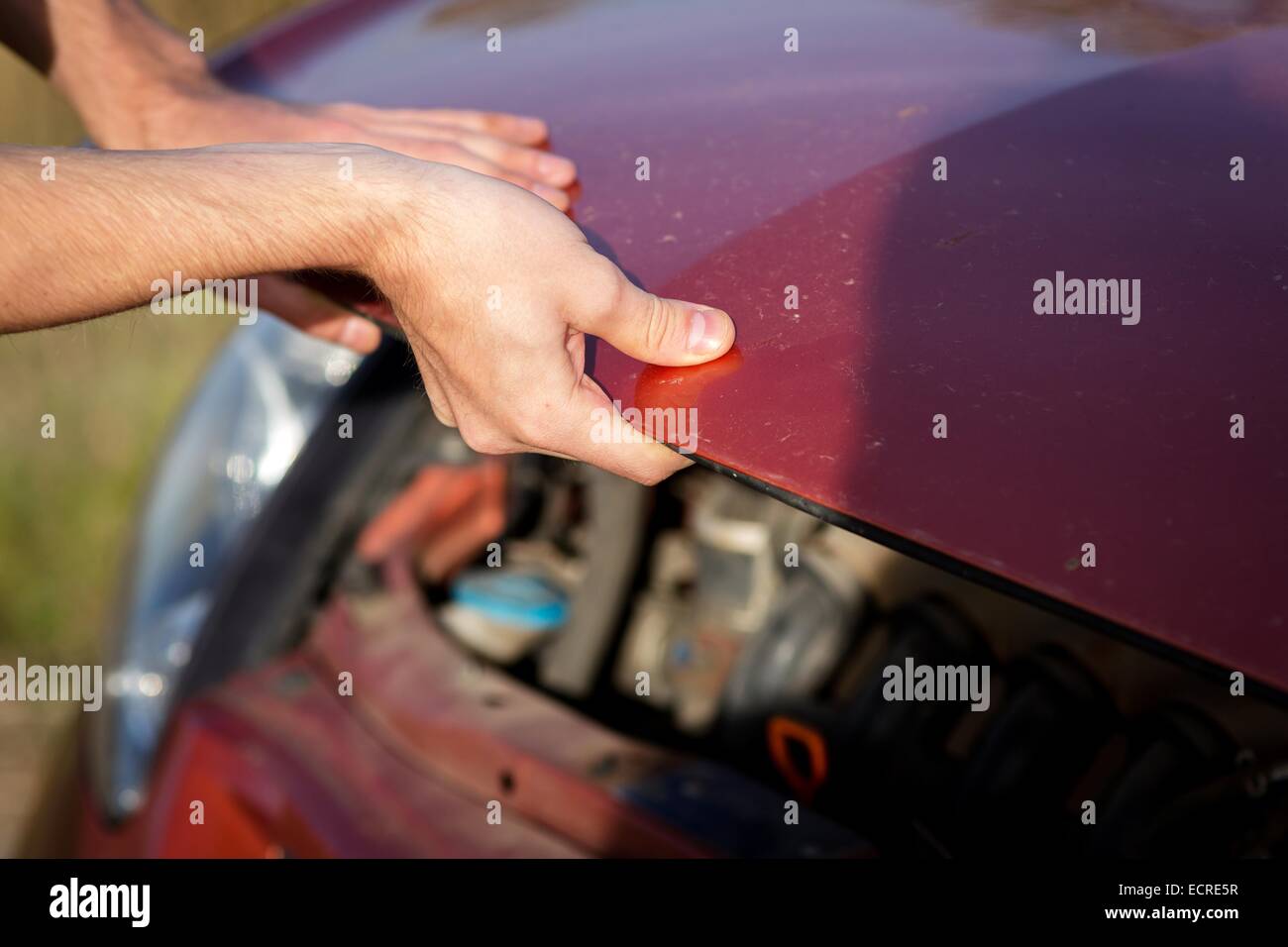 Man repairing motor block of a car Stock Photo - Alamy