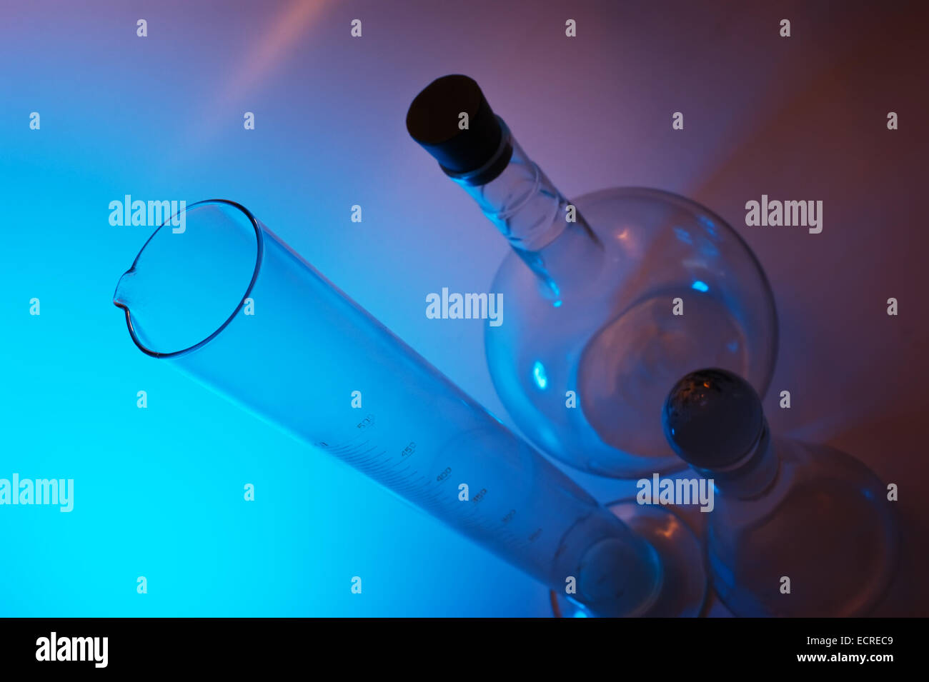 chemical glassware in multicolored lights Stock Photo - Alamy