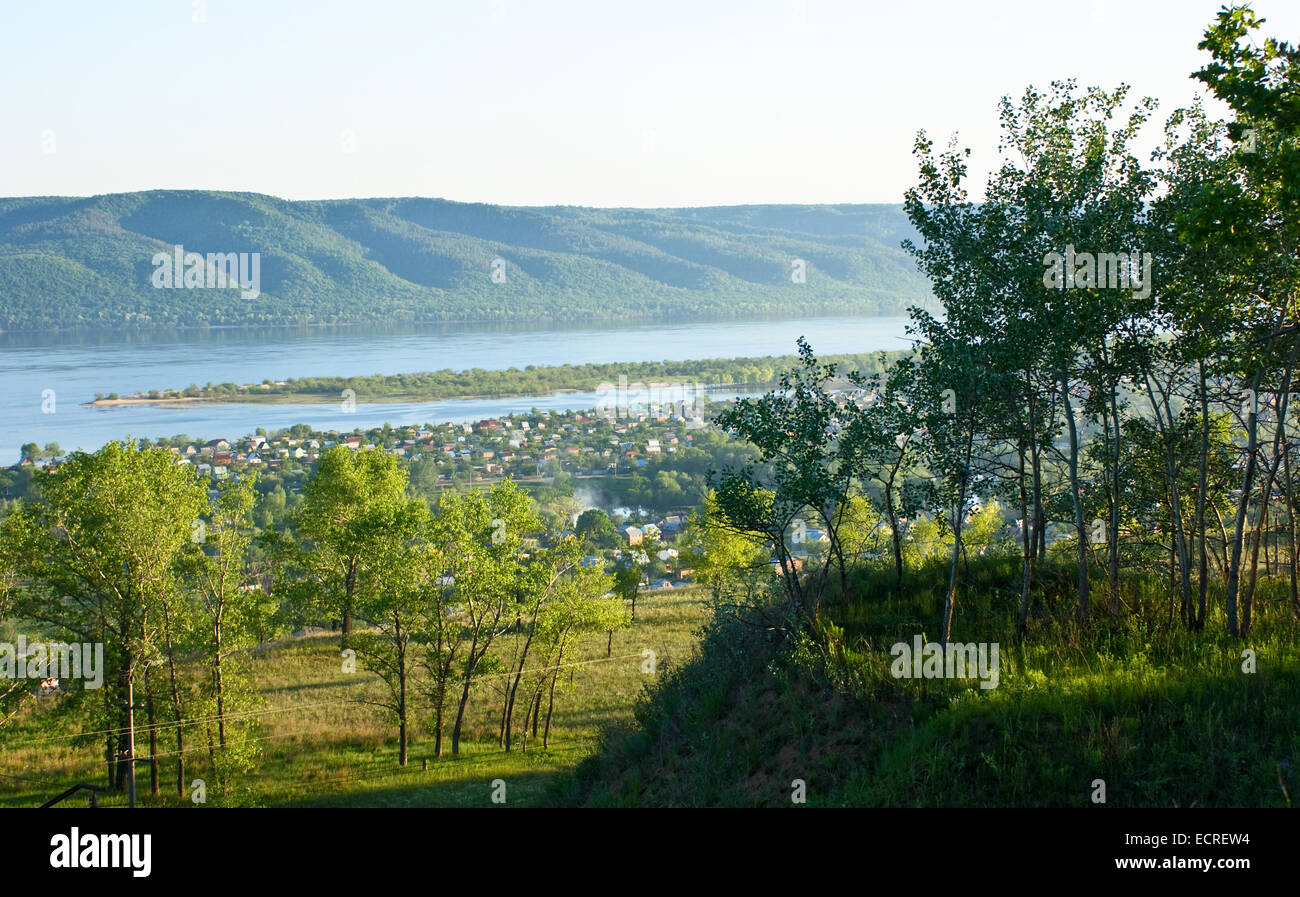 Tranquil rural scenery with house and river in countryside Stock Photo ...