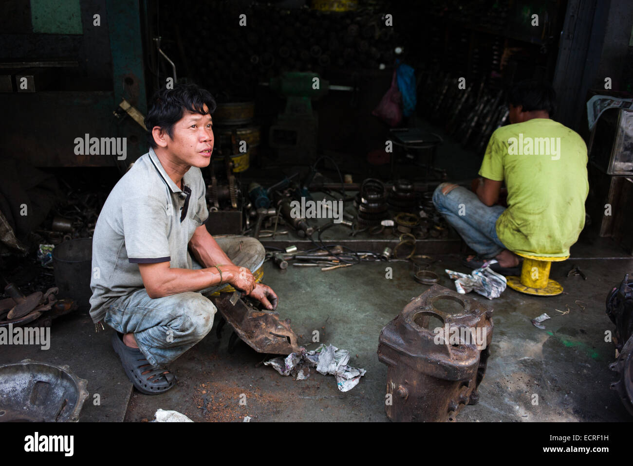 Burmese workers at a car junkyard shop, Chinatown siang kong, Bangkok ...
