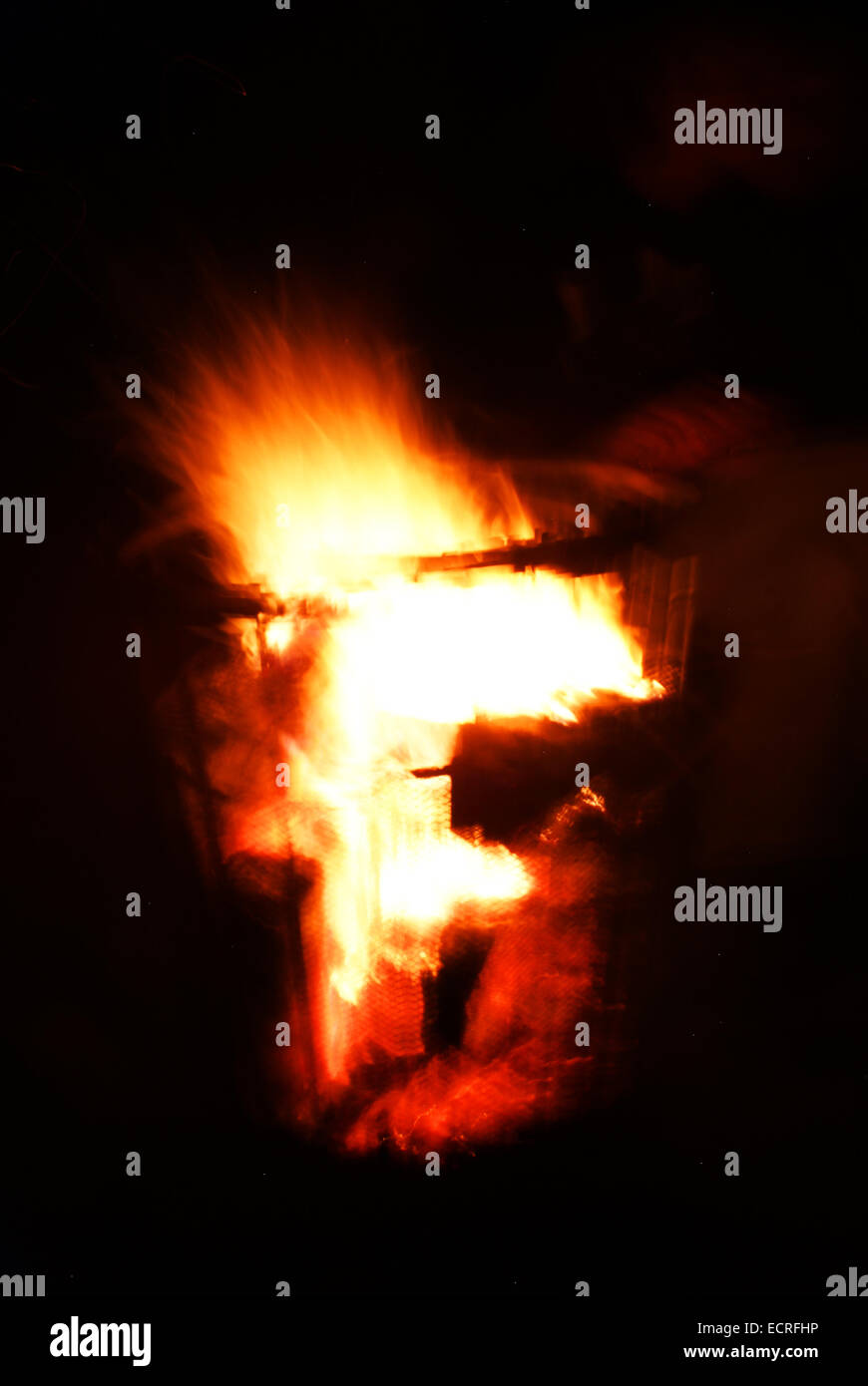 A blazing fire inside a fire pit Stock Photo - Alamy