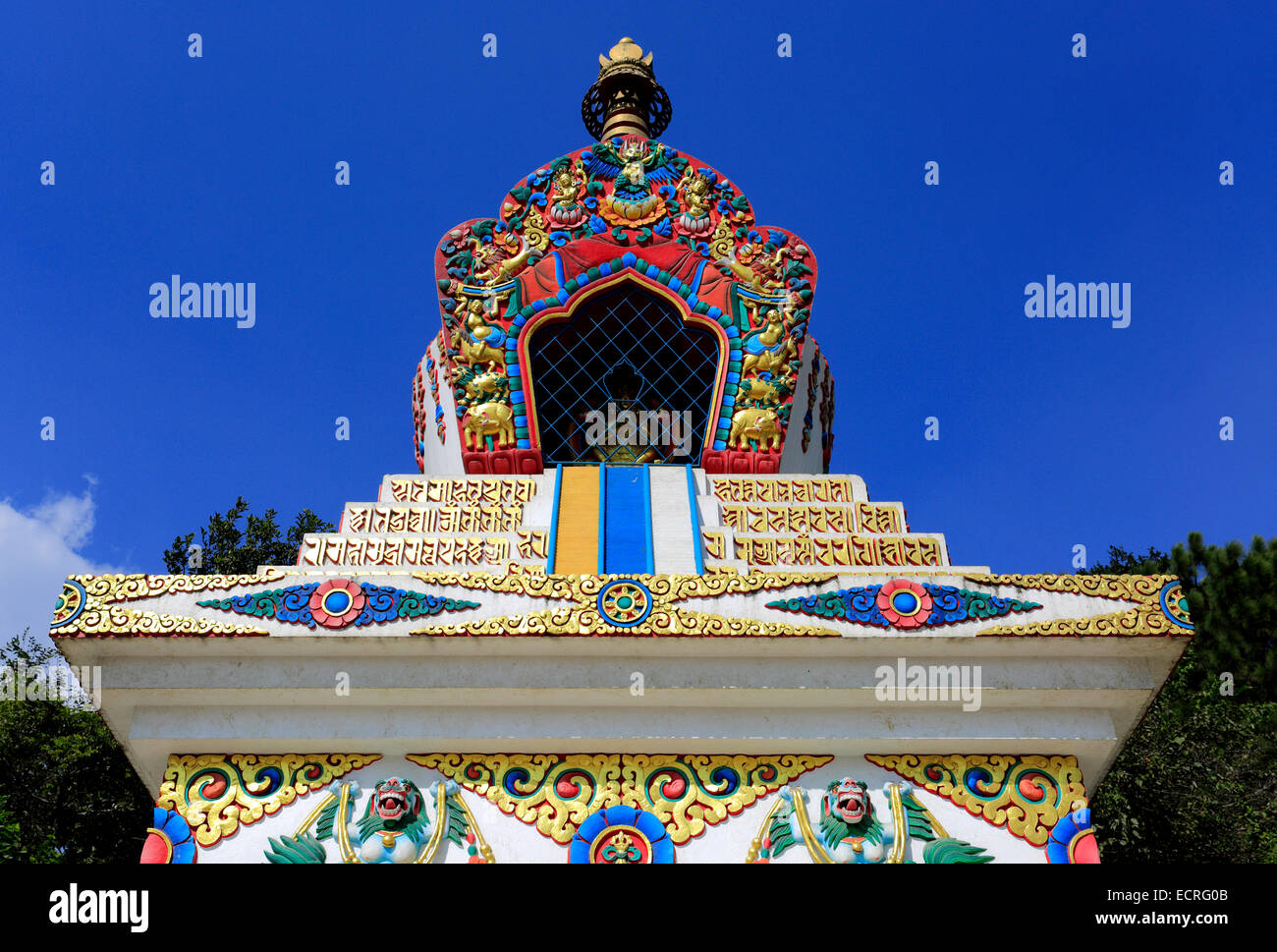 Buddhist Stupas at the 245 foot long prayer wheel wall built by the ...