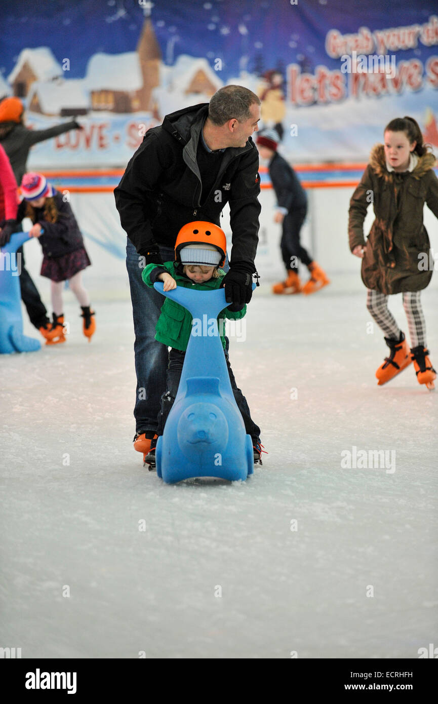 Father and son ice skating. Photo © George Sweeney/Alamy Stock Photo ...