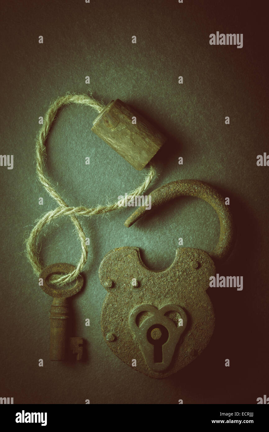 Rusty old padlock and key Stock Photo - Alamy