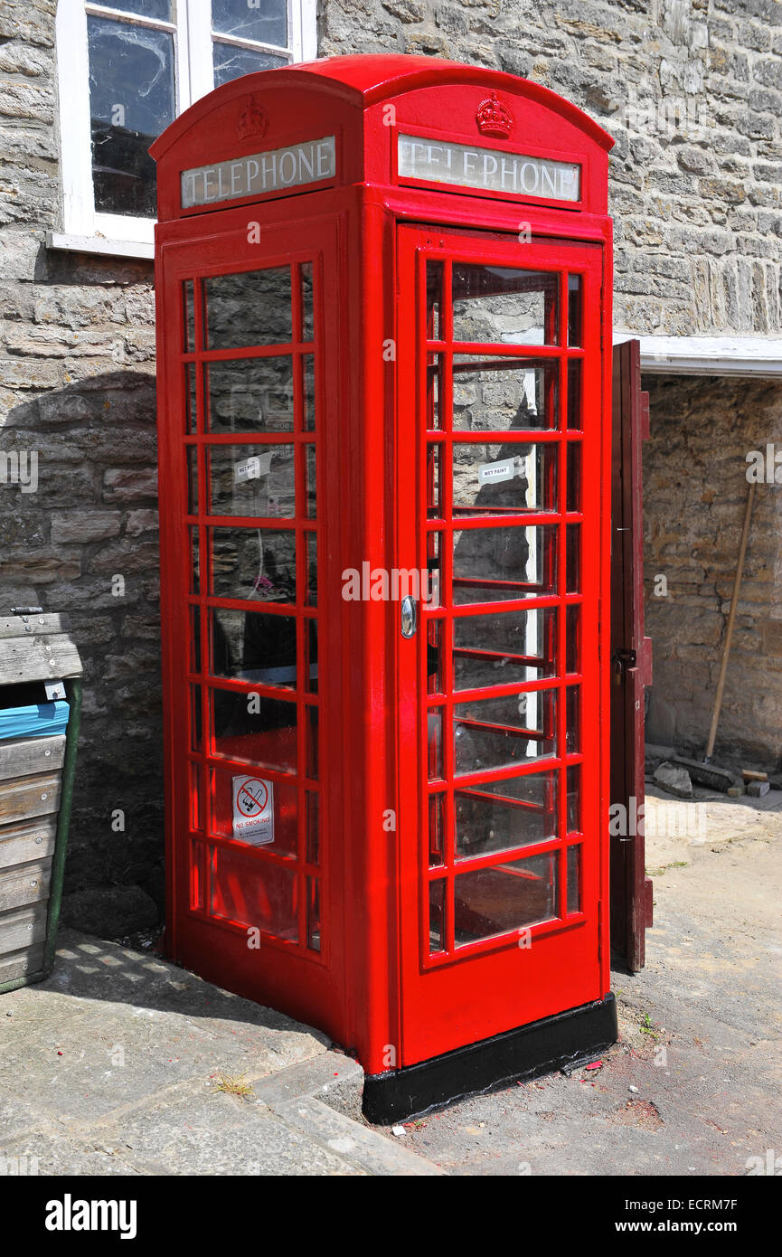 A traditional red telephone box in Corfe Castle Village, Dorset ...
