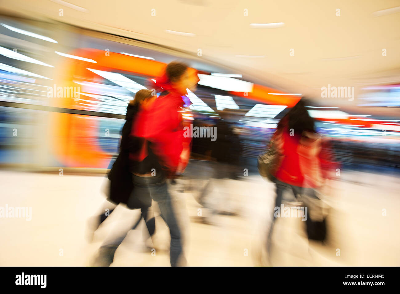 A shopper walking past a store window Stock Photo - Alamy