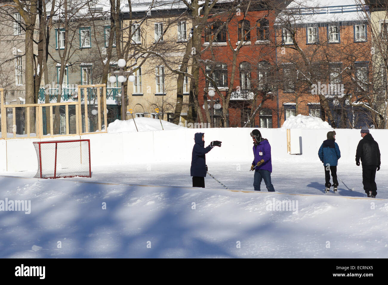 People playing hockey on an outdoor rink in Quebec, Canada Stock Photo ...