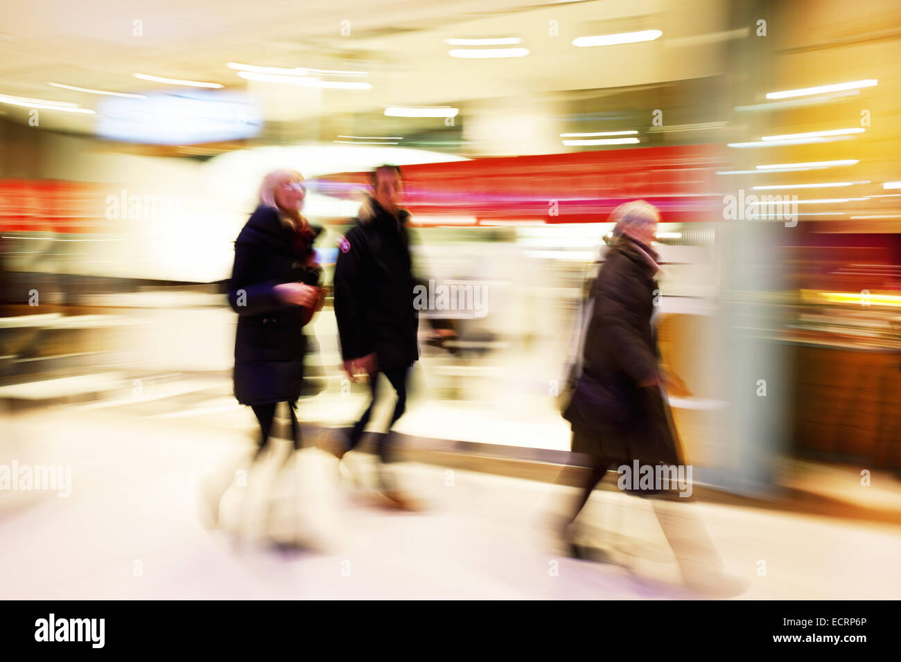 A shopper walking past a store window Stock Photo - Alamy
