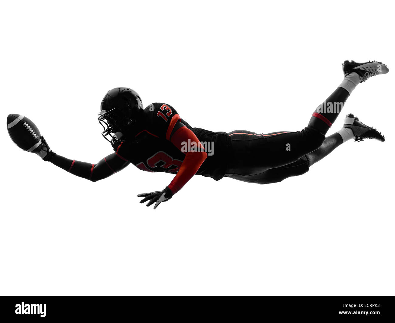 one american football player scoring touchdown in silhouette shadow on ...