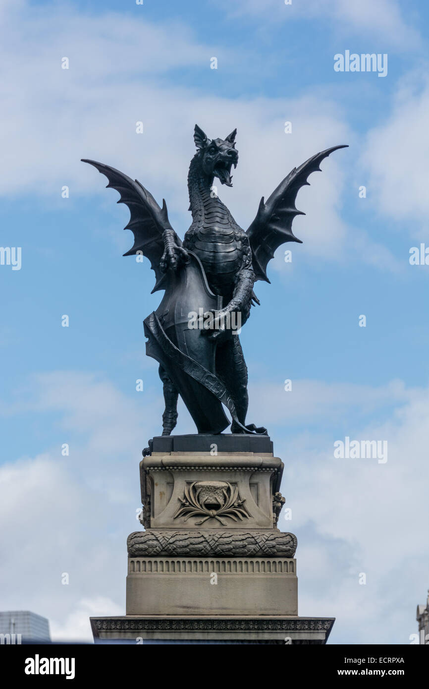 Statue of a heraldic dragon in the city of London in front of Royal ...