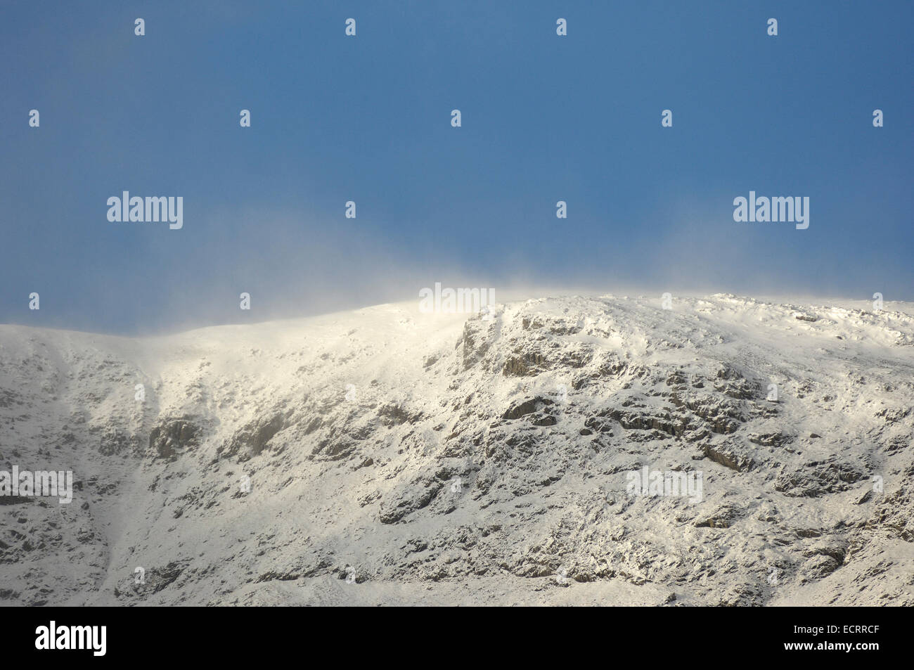 Wind blowing over snow covered peaks in the Cumbrian Mountains, England ...