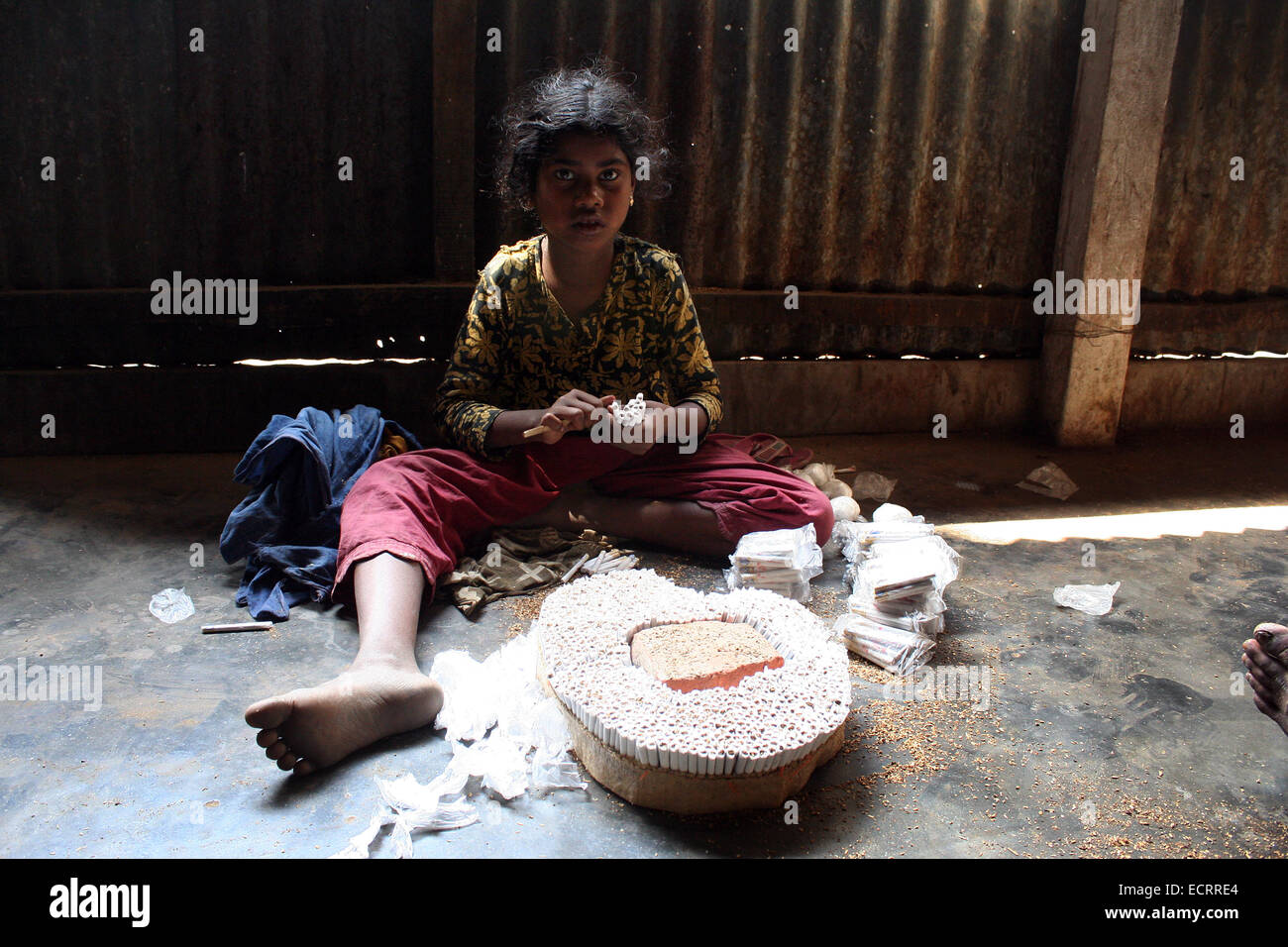 Bangladesh 8 may 2010. Child fill hand rolled cigarette (locally called ...