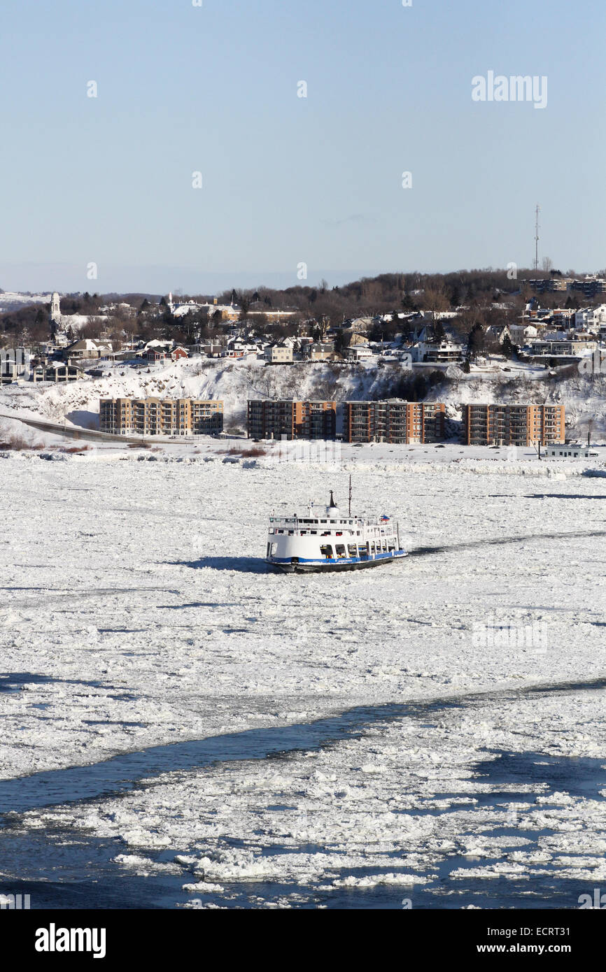The Quebec Ferry's crossing the St. Lawrence through heavy ice Stock ...