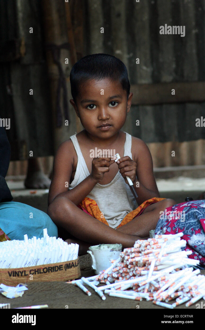 Bangladesh 8 may 2010. Child fill hand rolled cigarette (locally called ...
