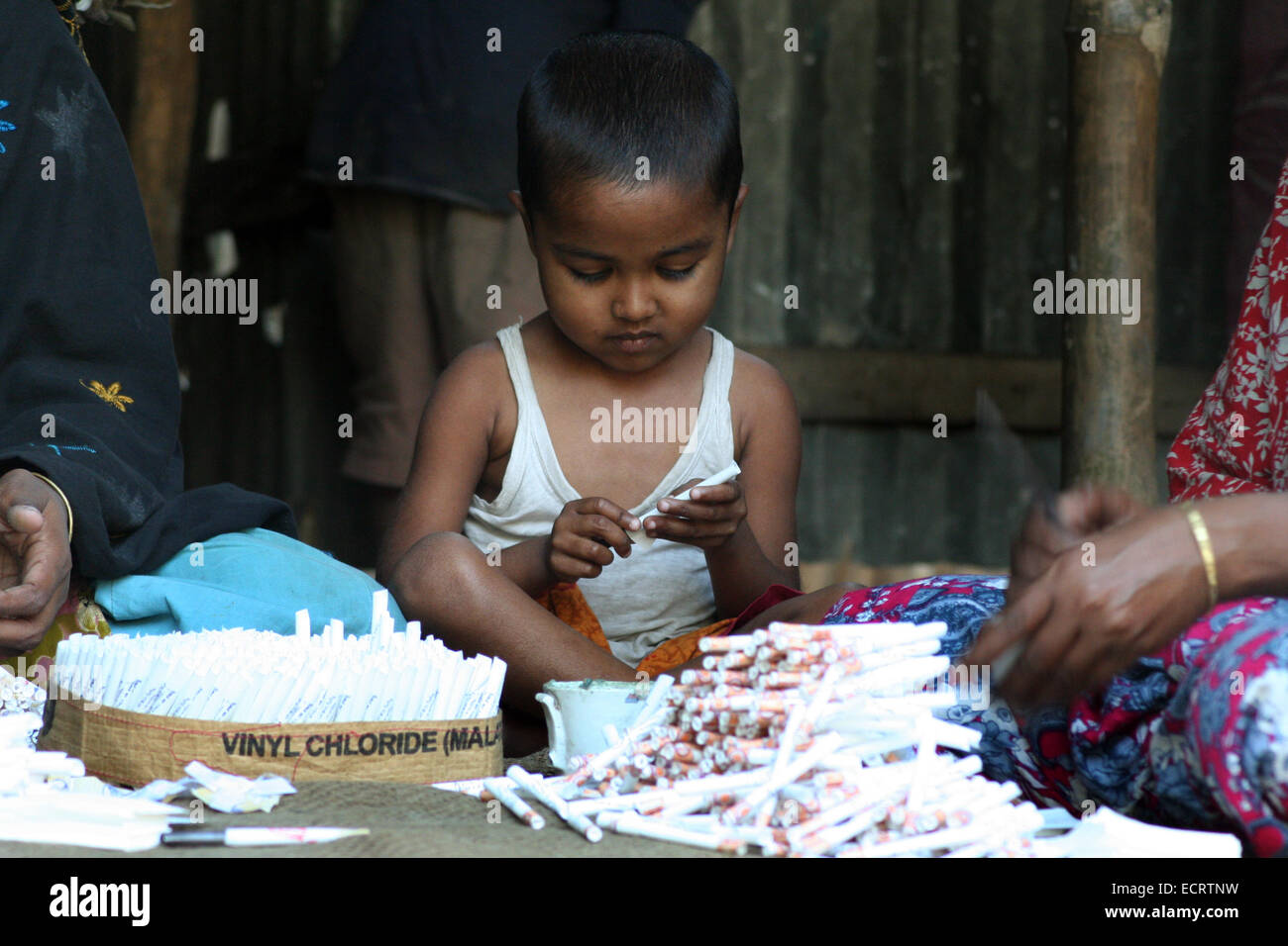 Bangladesh 8 may 2010. Child fill hand rolled cigarette (locally called ...