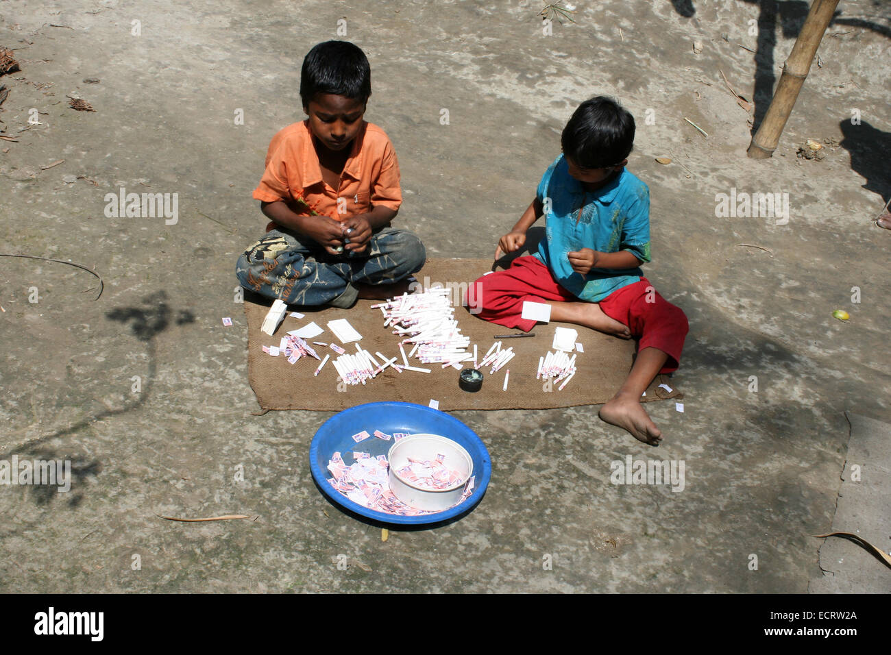 Bangladesh 8 may 2010. Child fill hand rolled cigarette (locally called ...