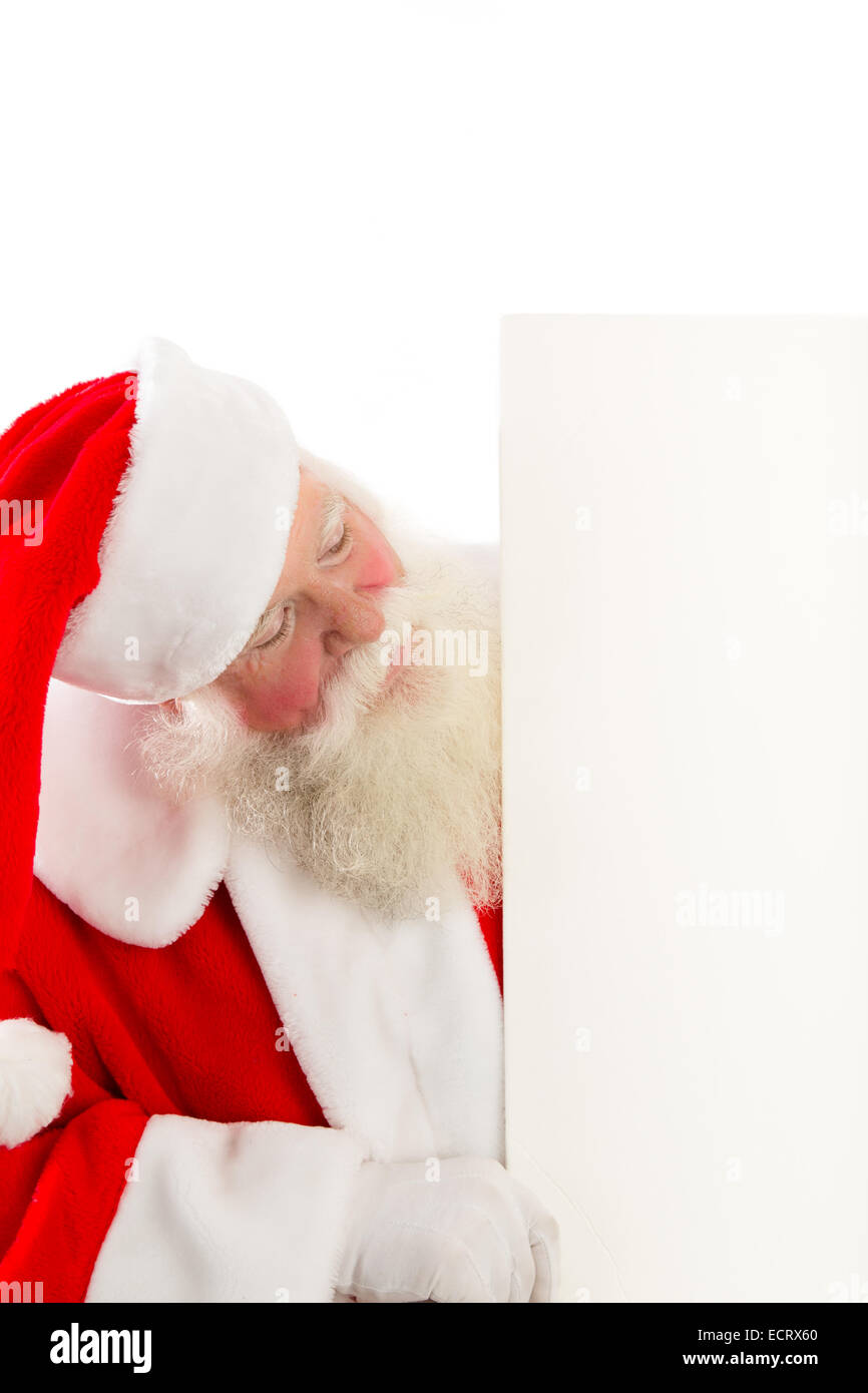 Santa looks around the side at the blank white sign he is holding. Room ...