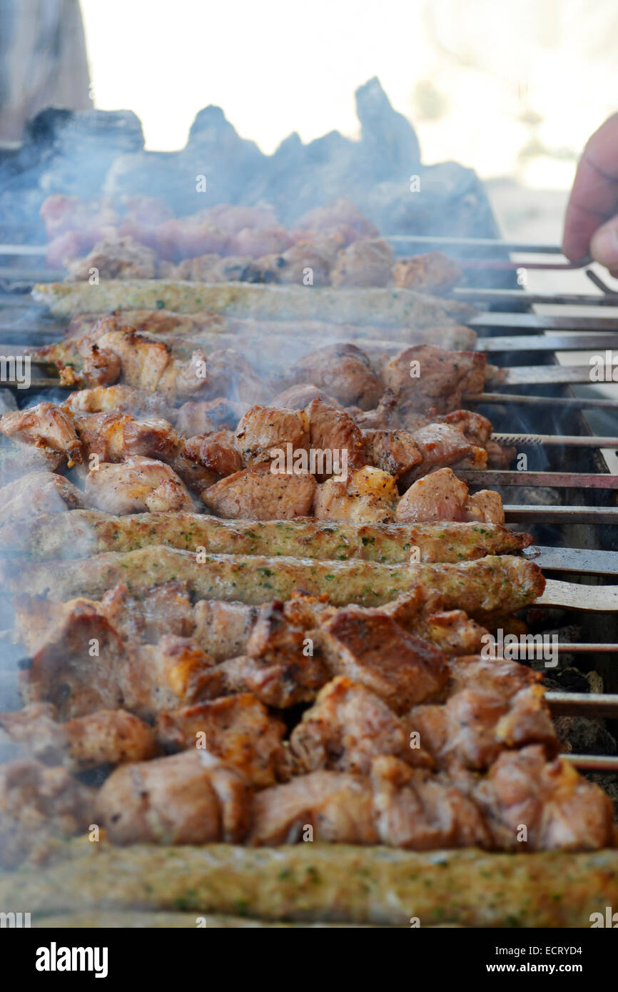 Mediterranean Kebab & sheep meat being grilled outdoor Stock Photo - Alamy