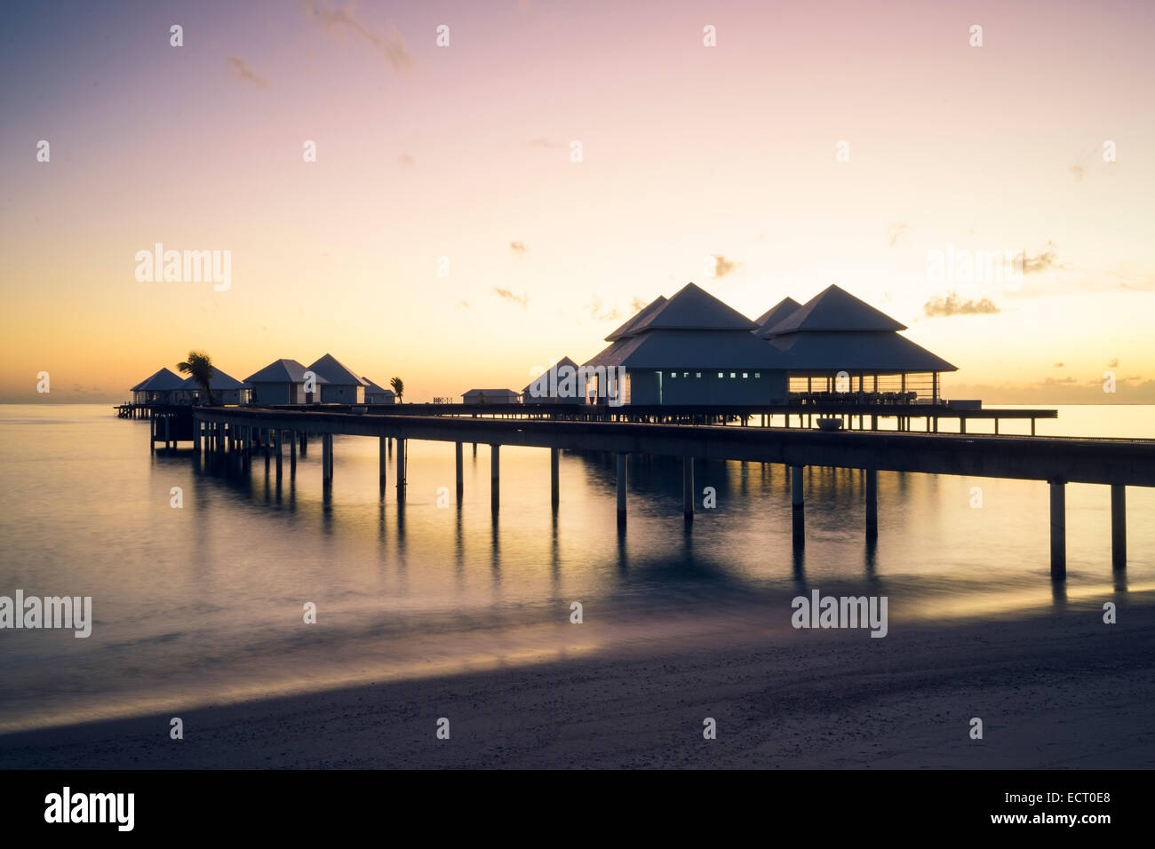 Maldives Ari Atoll view to vacation homes at sunset Stock Photo - Alamy
