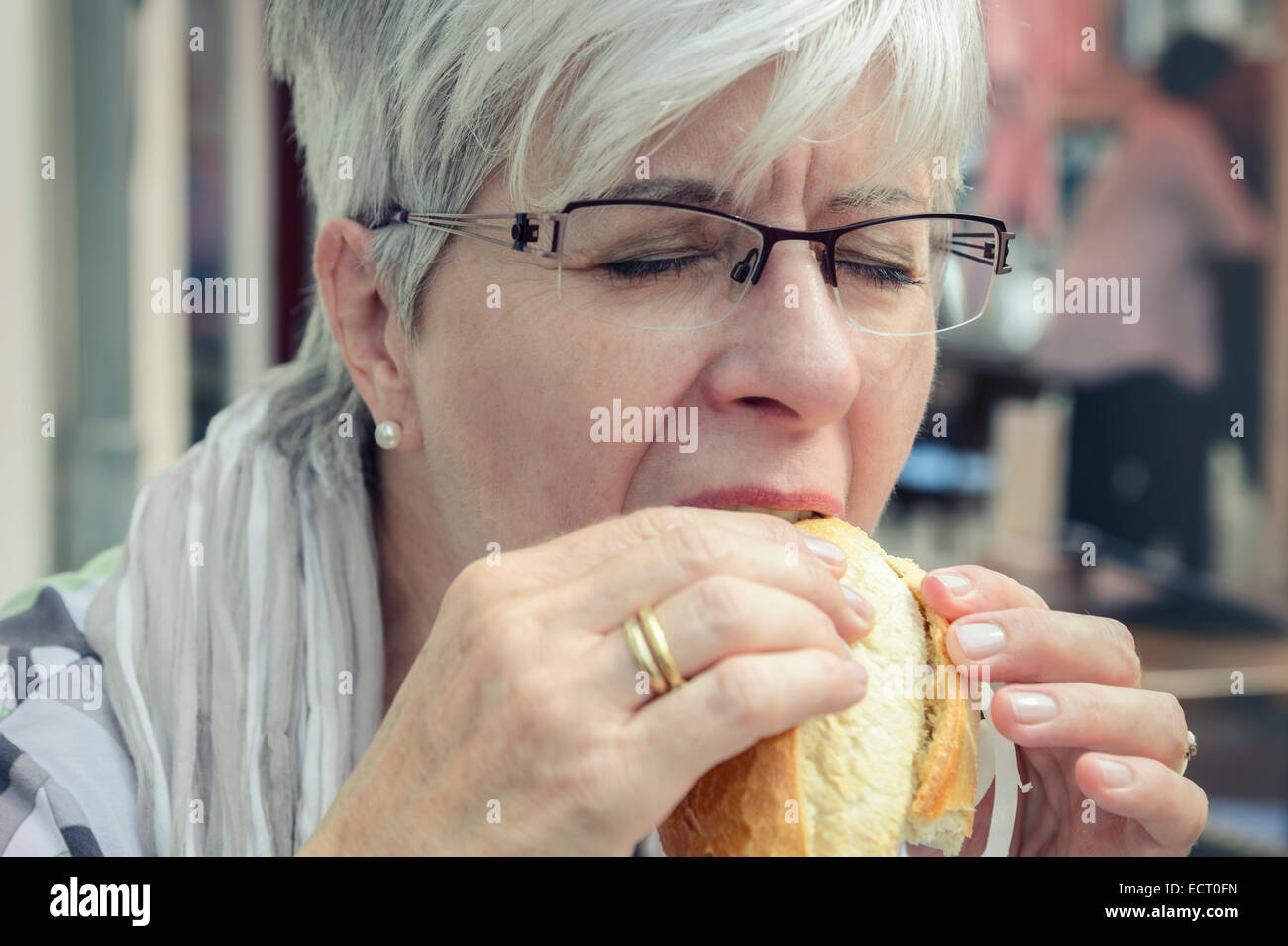 Senior woman eating fish hi-res stock photography and images - Alamy