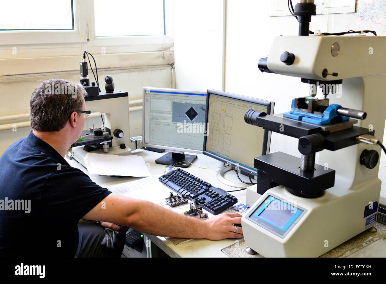 Materials tester doing quality check in hardening shop Stock Photo - Alamy