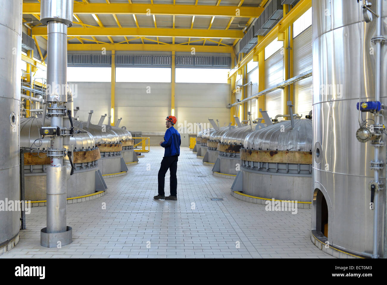 Worker in a sugar mill Stock Photo - Alamy