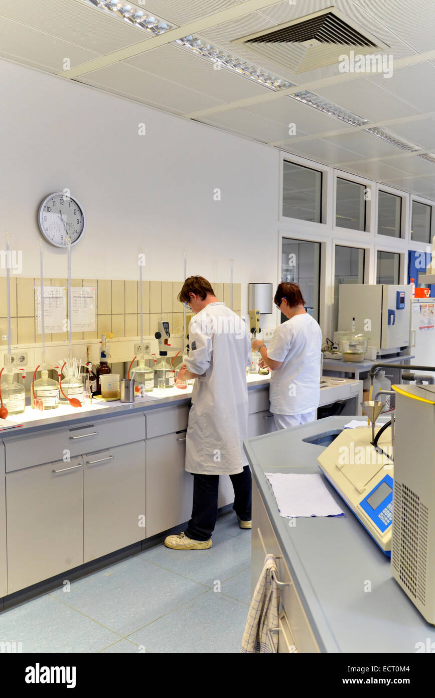 Lab technicians examining products of a sugar mill Stock Photo - Alamy