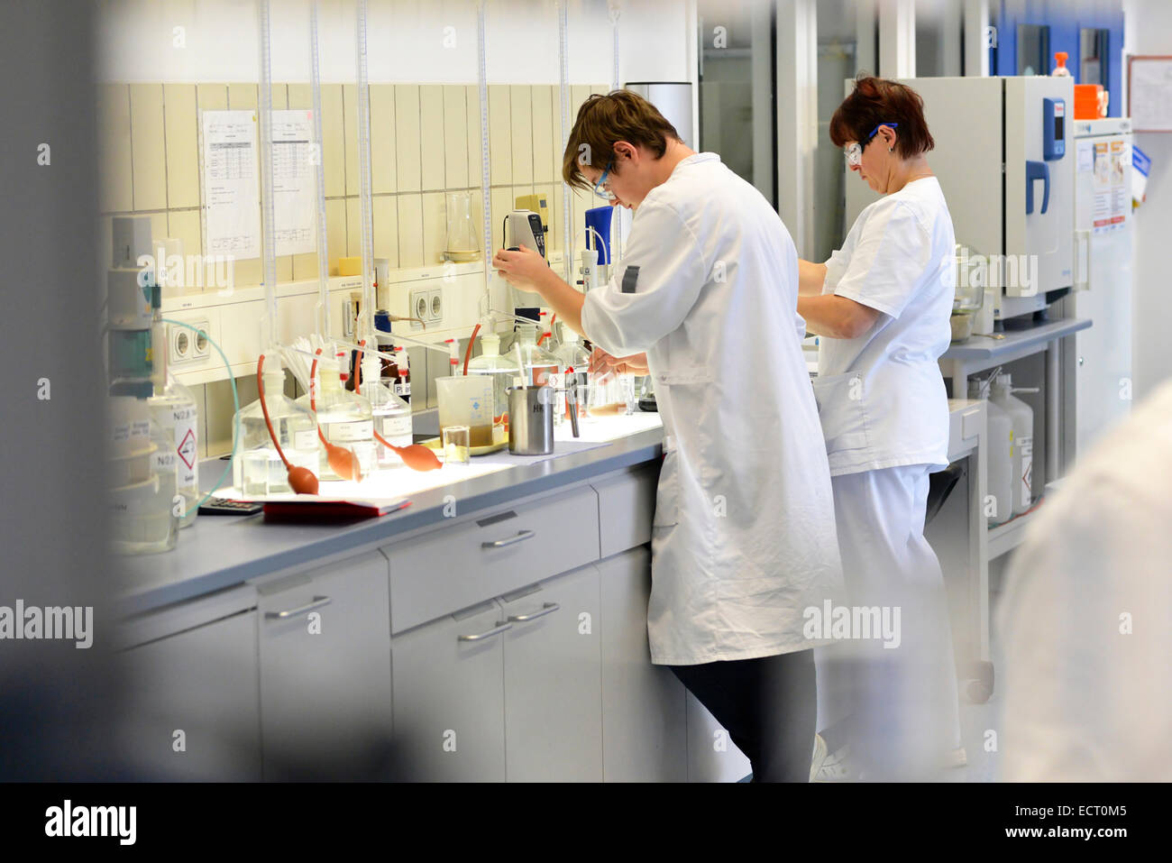 Lab technicians examining products of a sugar mill Stock Photo - Alamy
