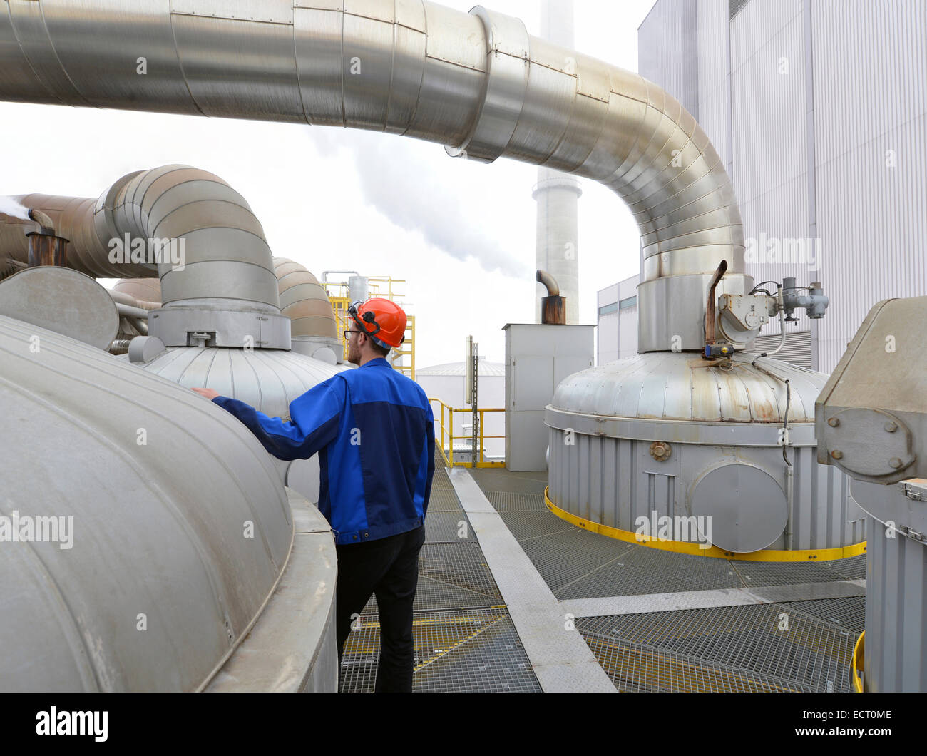 Worker at evaporator station in a sugar mill Stock Photo - Alamy