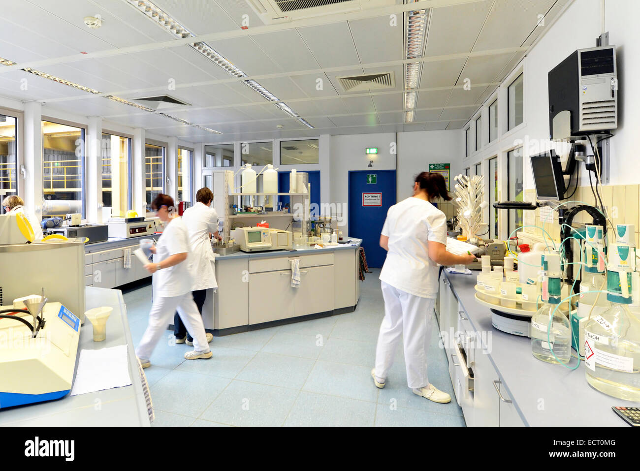 Lab technicians examining products of a sugar mill Stock Photo - Alamy