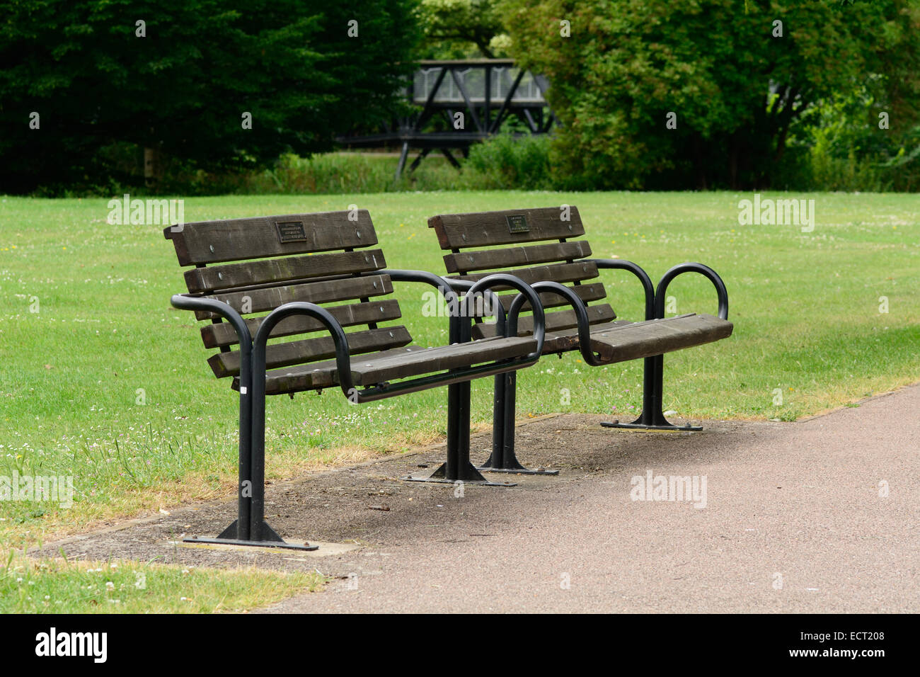 Two park benches side by side Stock Photo - Alamy