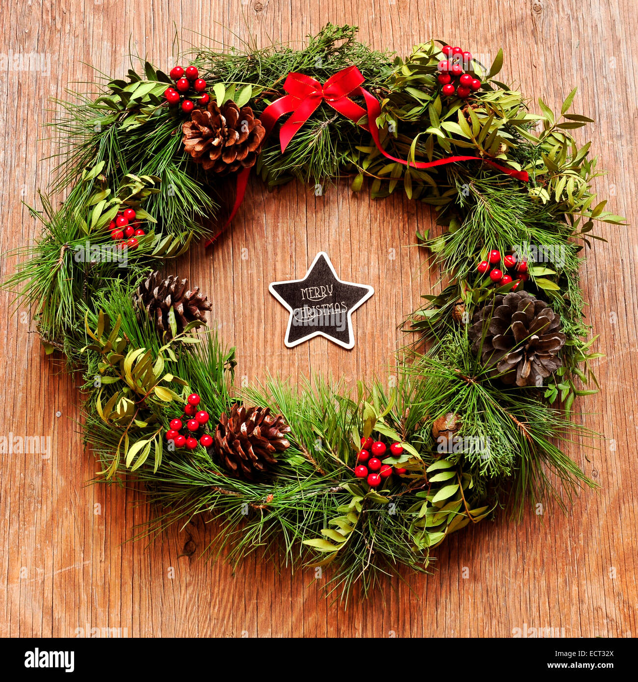the sentence merry christmas written in a star-shaped chalkboard and a ...