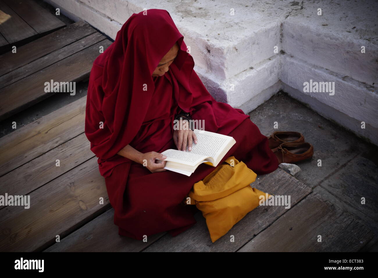 A Buddhist devotee praying at the Great Boudhanath Stupa a UNESCO World ...