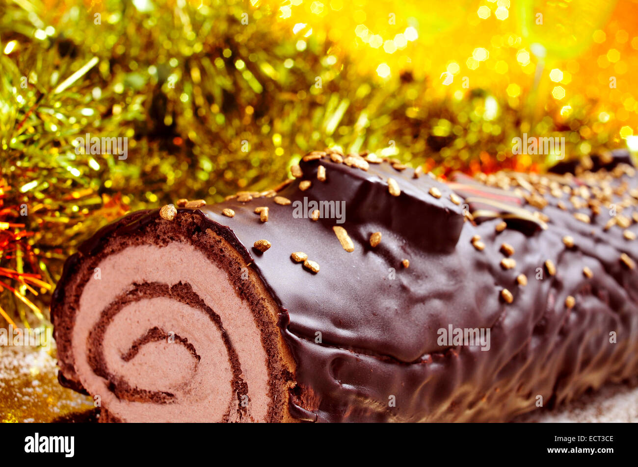 a yule log cake, traditional of christmas time, on a festive table ...