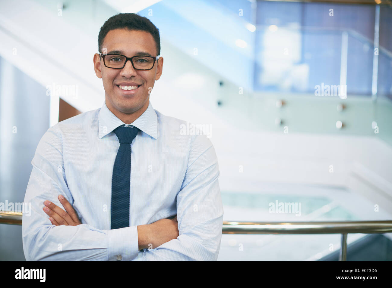 Happy cross-armed businessman looking at camera Stock Photo - Alamy