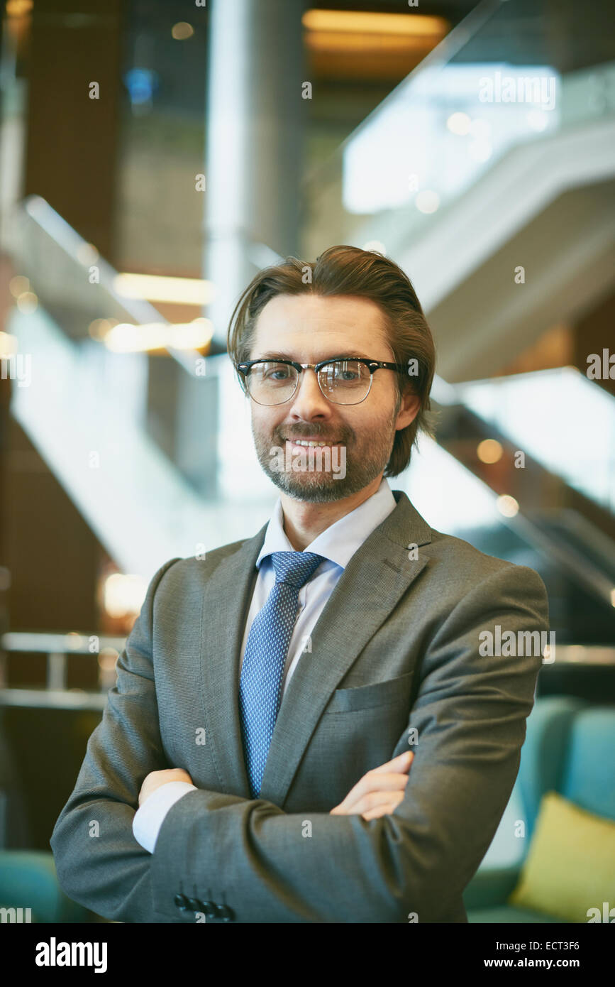 Mature boss looking at camera Stock Photo - Alamy