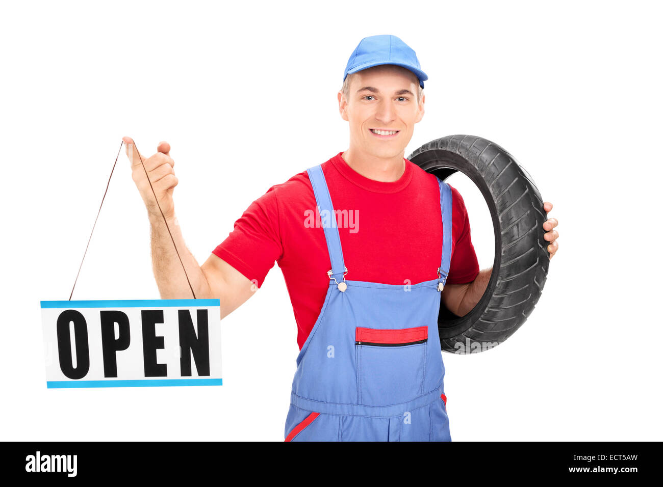 Young male mechanic holding open sign isolated on white background ...