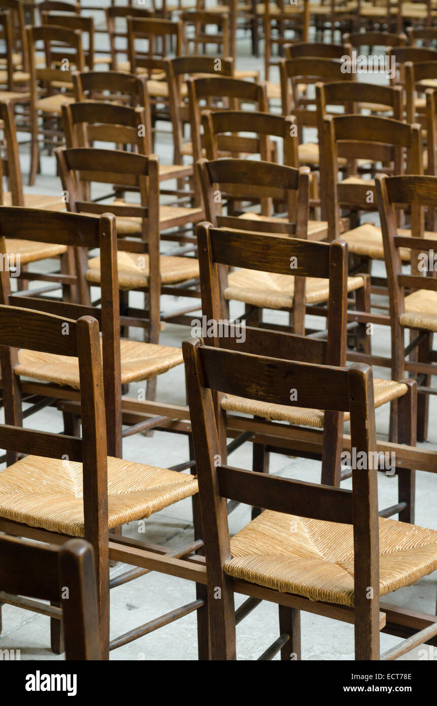 Rows of worn chairs in a church in Paris, France Stock Photo - Alamy
